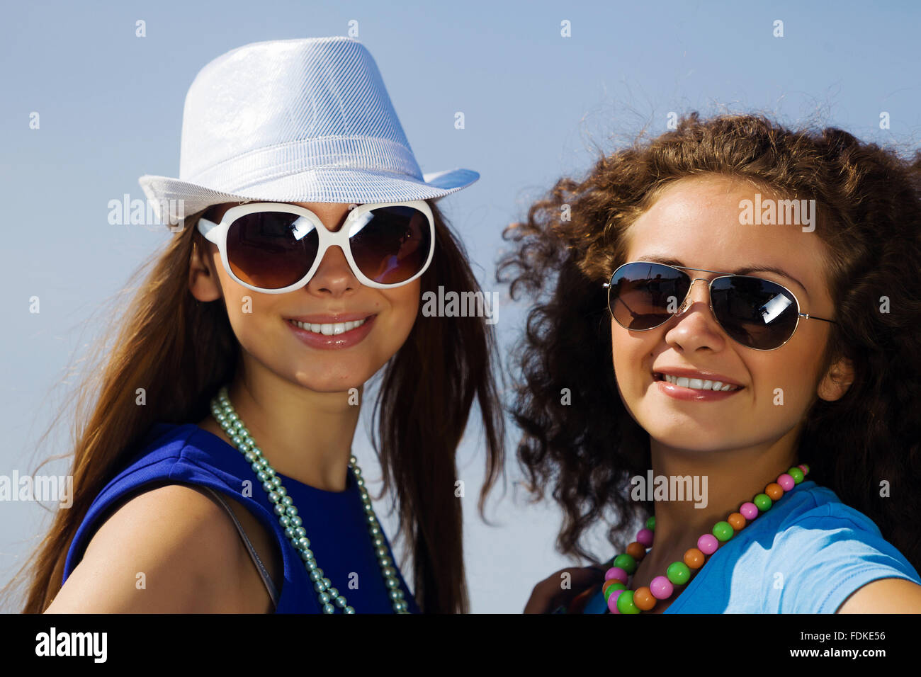 Attractive young women having fun outdoors. Summer vacation Stock Photo ...