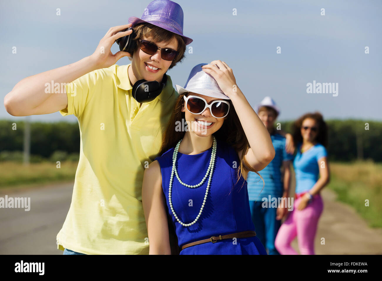 Young man and young woman outdoors. Summer vacation Stock Photo - Alamy