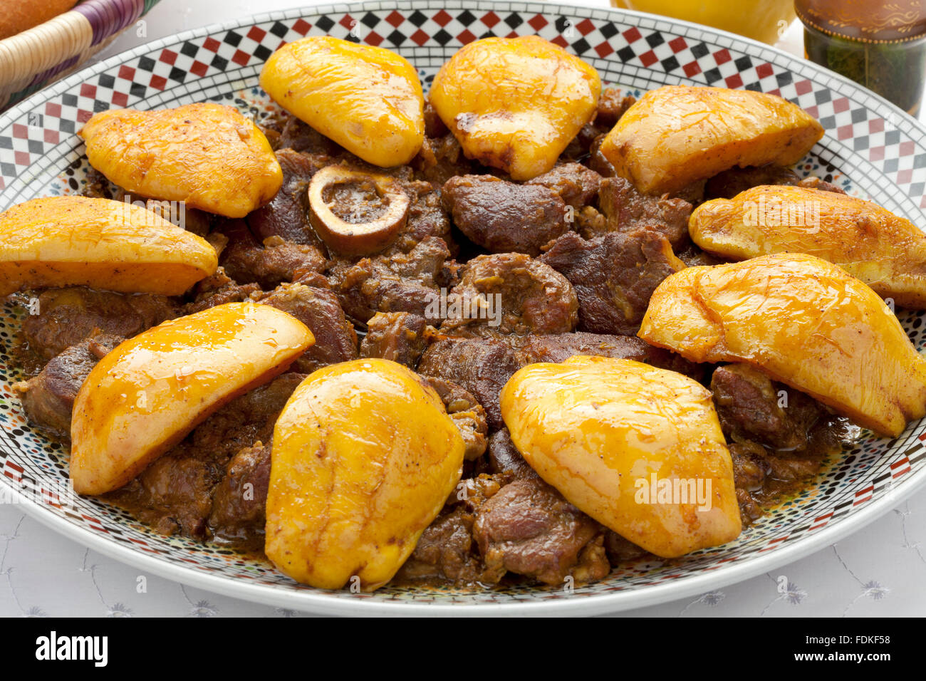 Traditional Moroccan dish with meat and Safarjal closeup on white ...