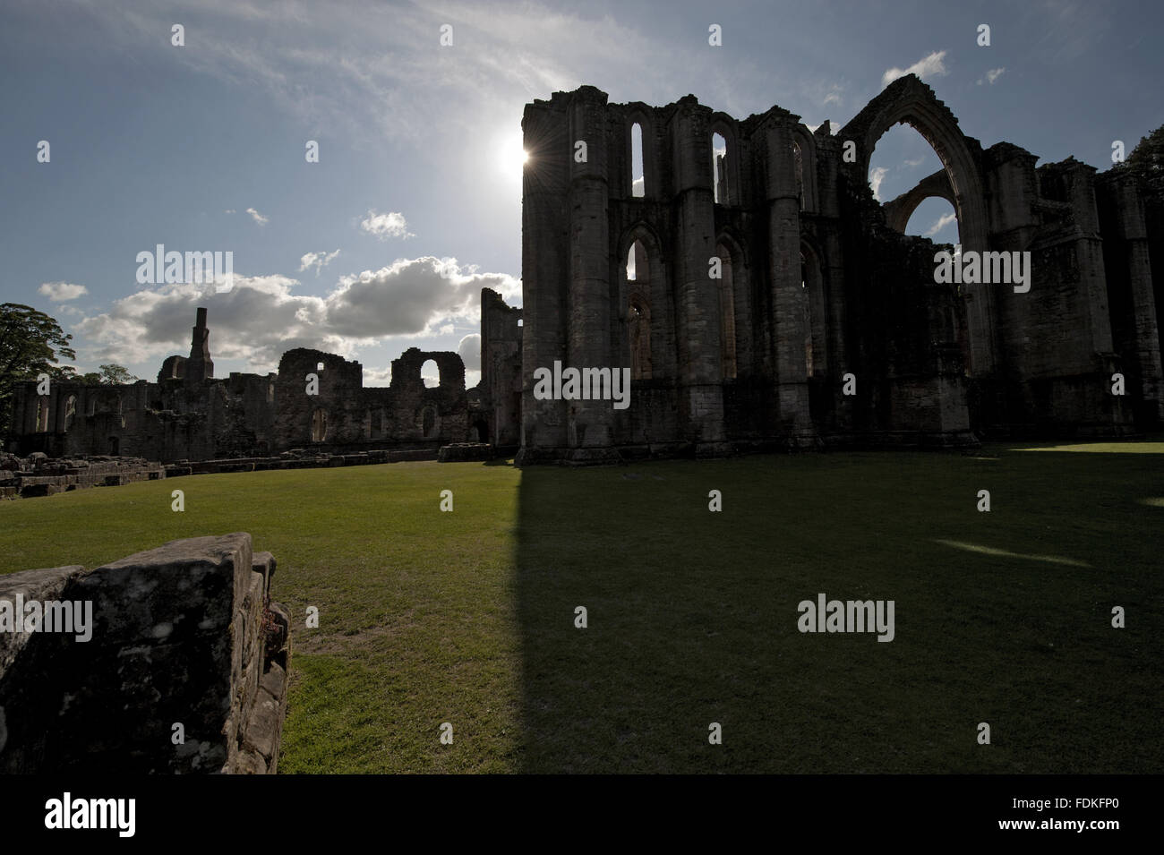 Long evening shadows at Fountains Abbey, North Yorkshire Stock Photo ...