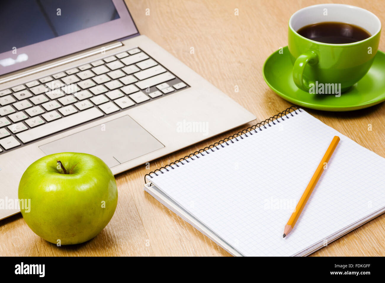 Tablet pc cup of coffee and notepad at table Stock Photo - Alamy