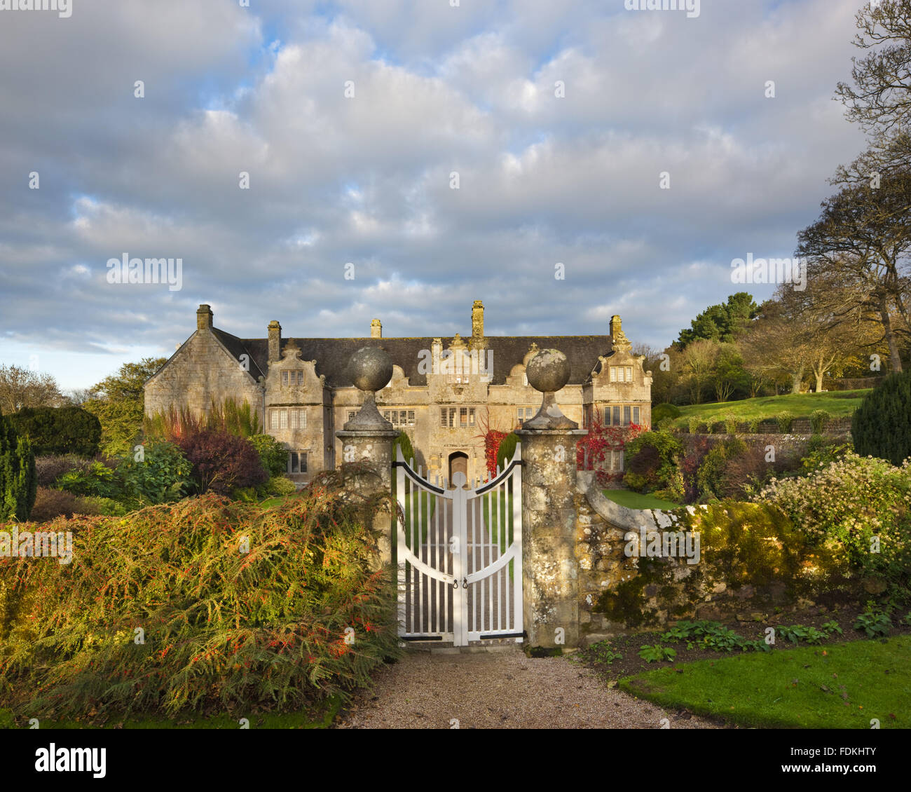 The east front seen beyond the gates at Trerice, Cornwall. This facade ...