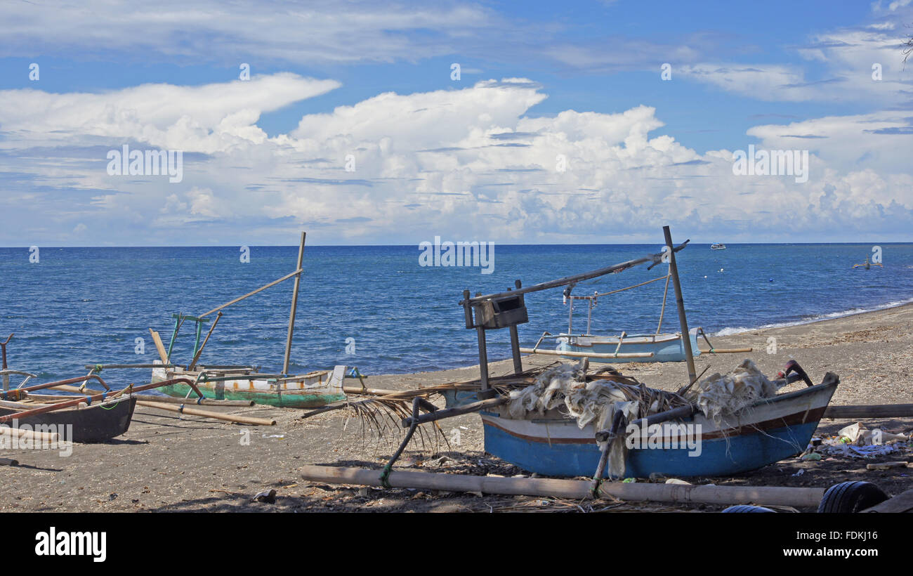 Sea shore in Indonesia with boats Stock Photo - Alamy