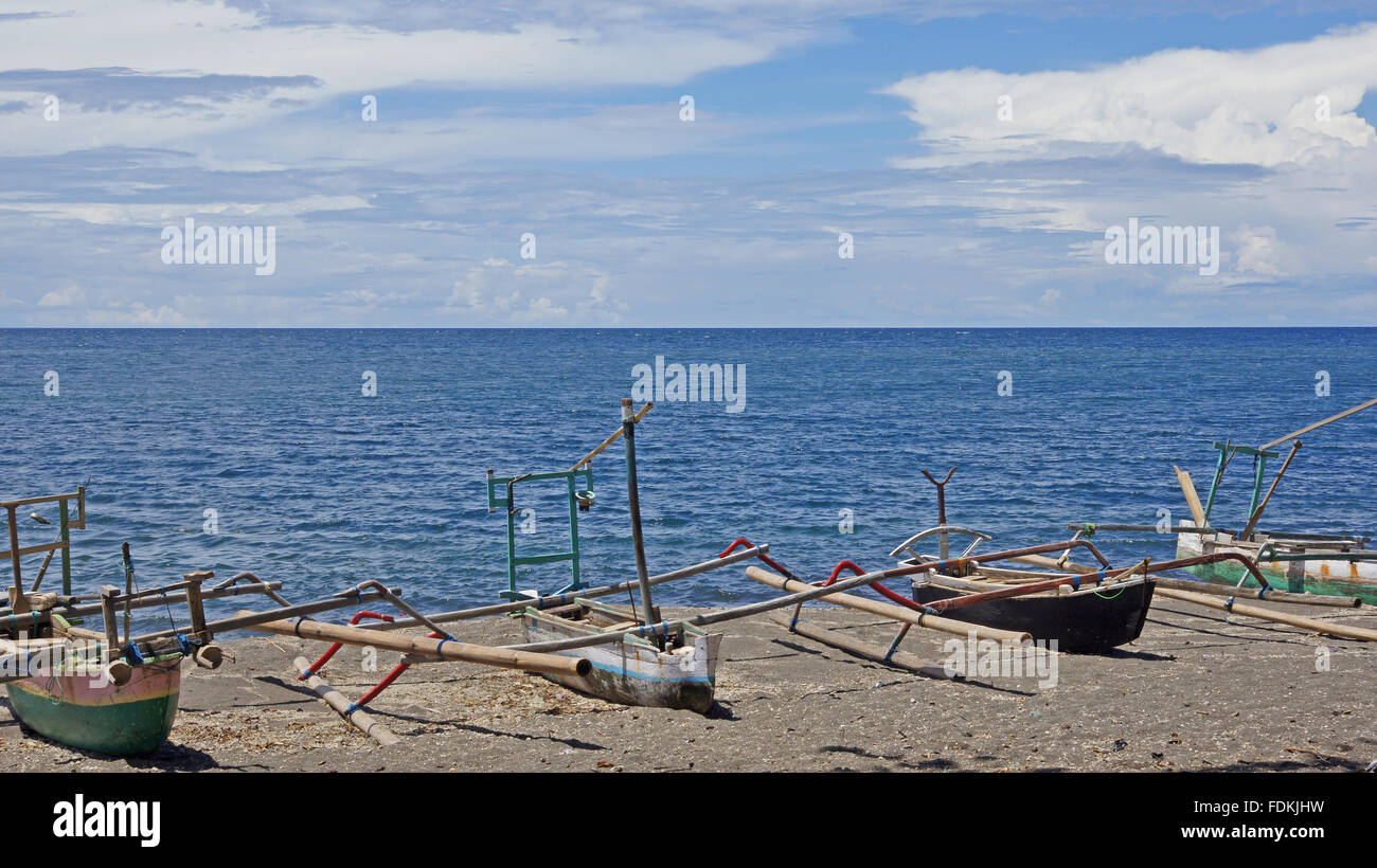 Sea shore in Indonesia with boats Stock Photo - Alamy
