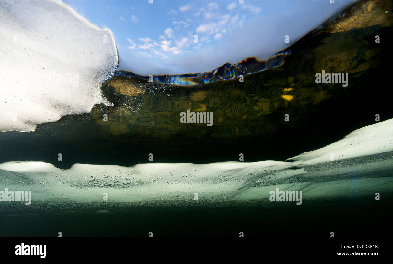 Underwater view of ice on a lake, Snowdonia, Wales, in December Stock ...