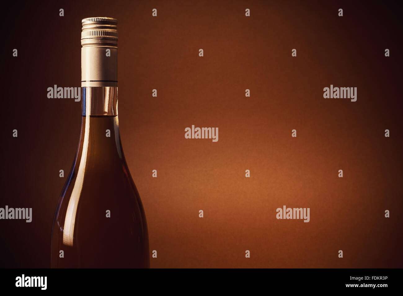 One bottle of spirit drink on brown background Stock Photo - Alamy