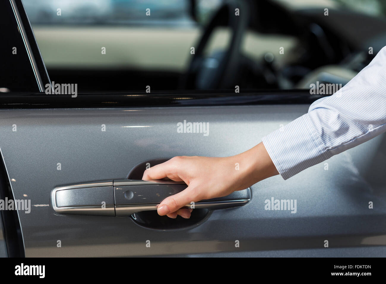 Close up of human hand opening door of car Stock Photo - Alamy