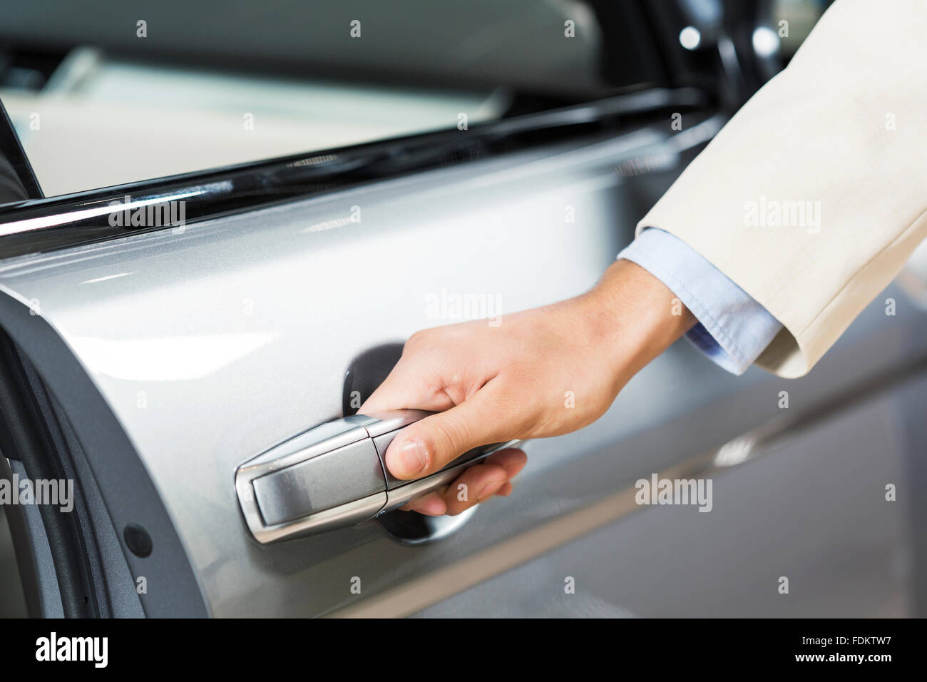 Close up of human hand opening door of car Stock Photo - Alamy