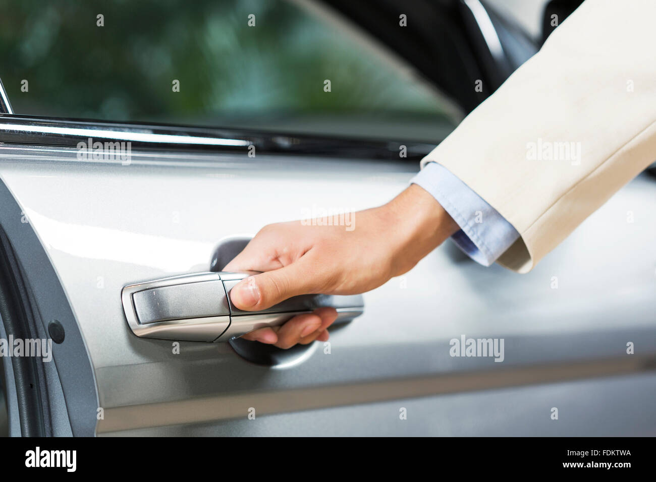 Close up of human hand opening door of car Stock Photo - Alamy