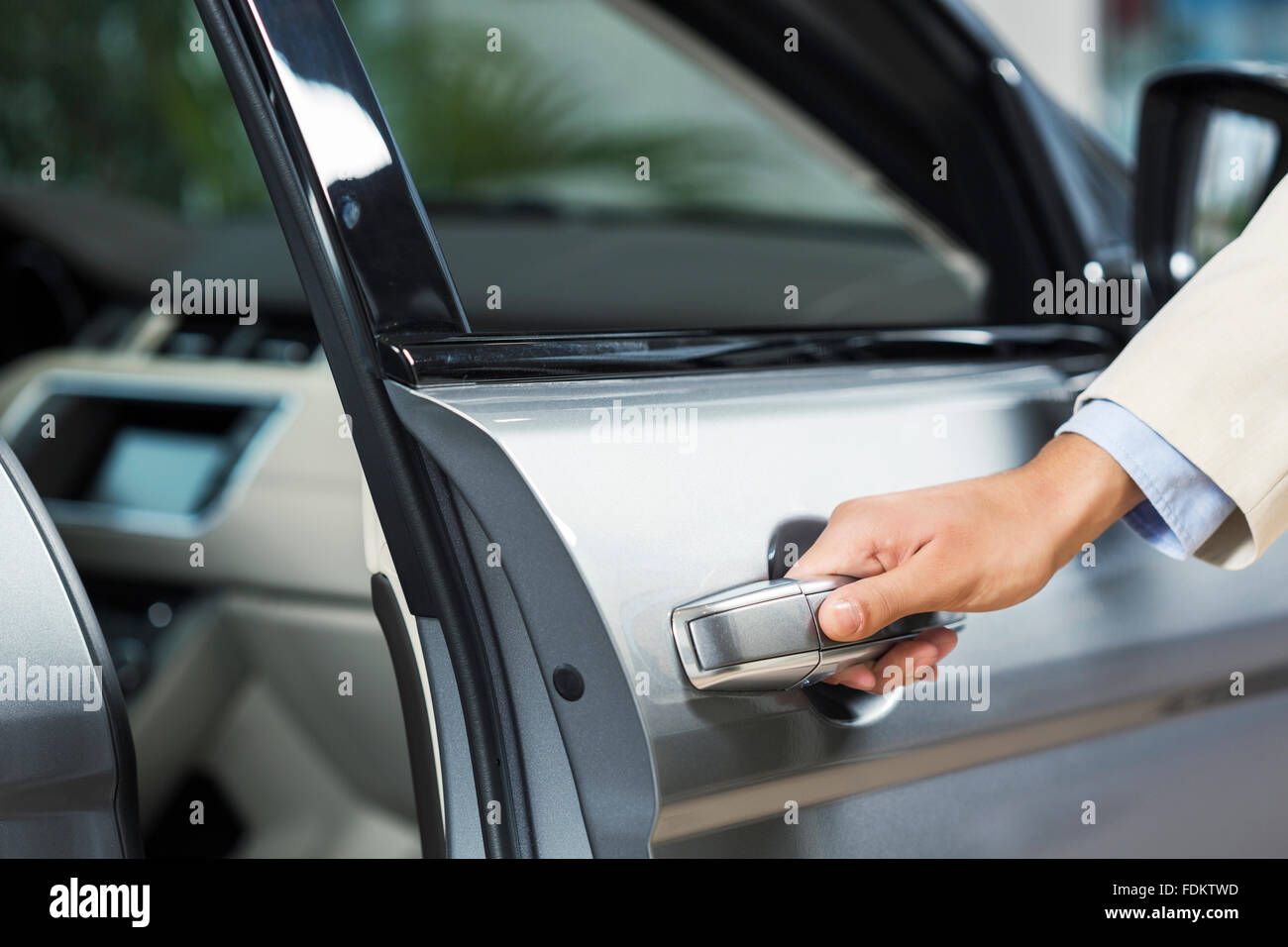 Close up of human hand opening door of car Stock Photo - Alamy