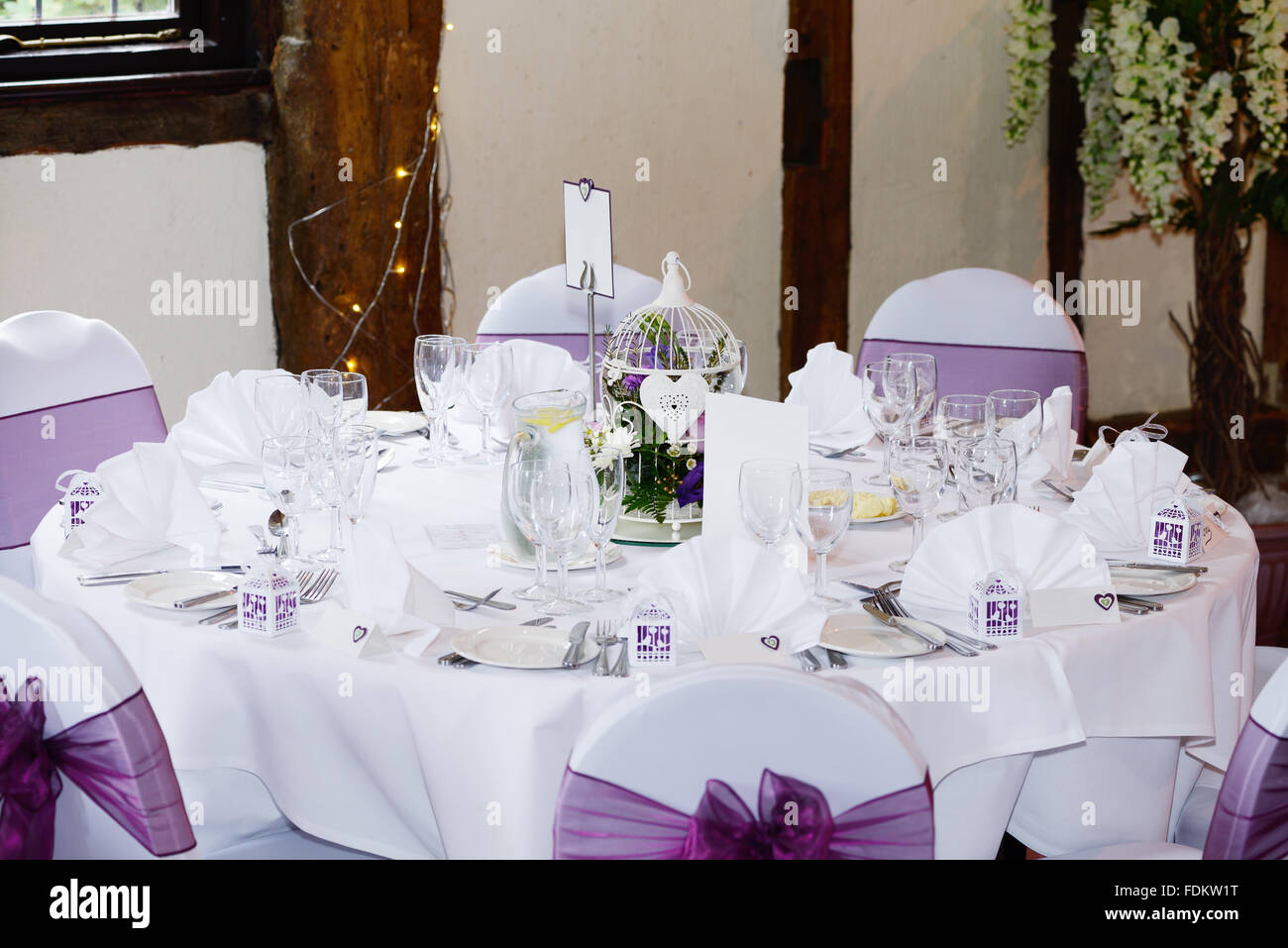 Wedding table details with violet decoration Stock Photo - Alamy