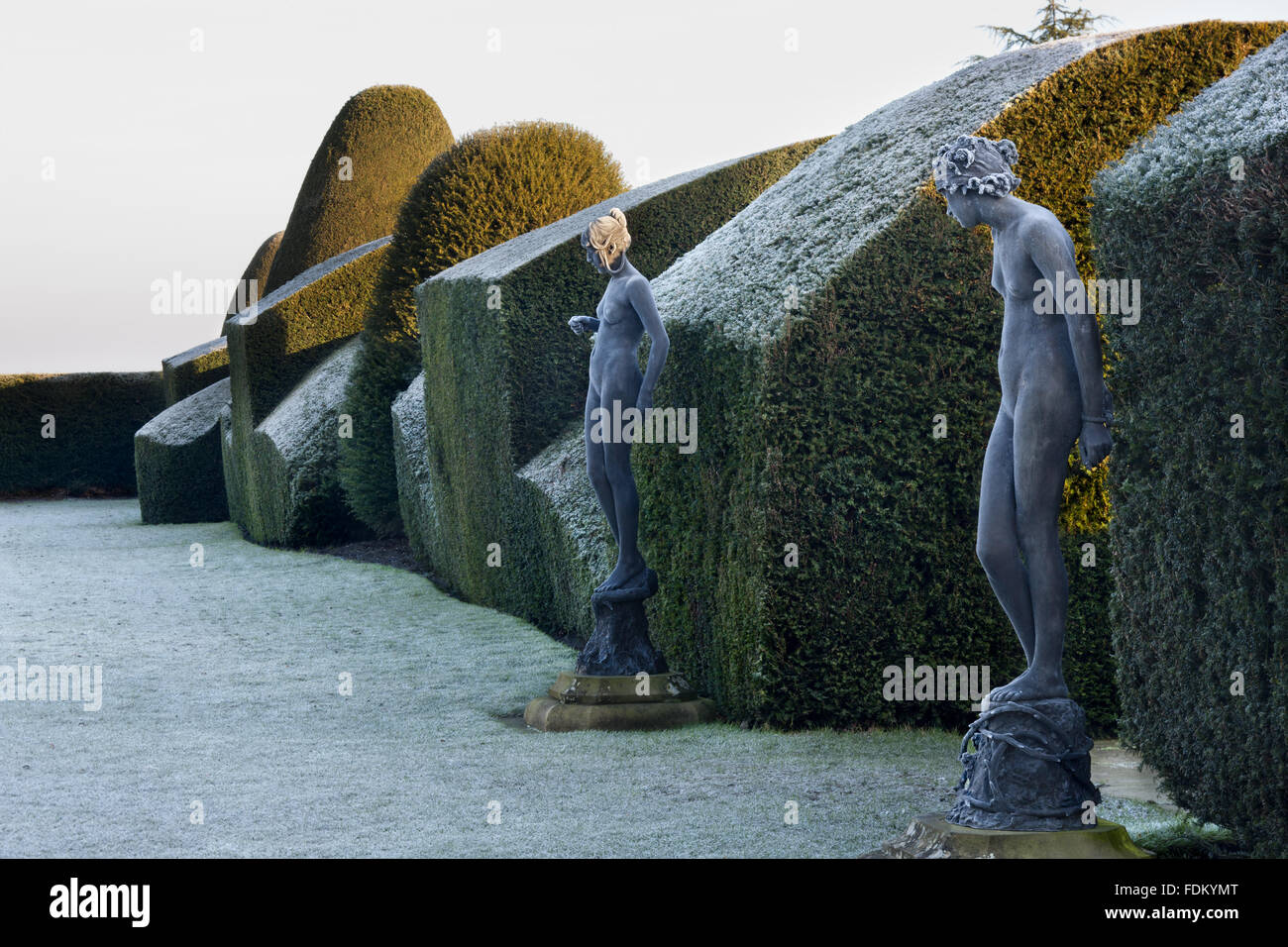 Nymph statues and yew hedging in winter at Chirk Castle, Wrexham Stock ...