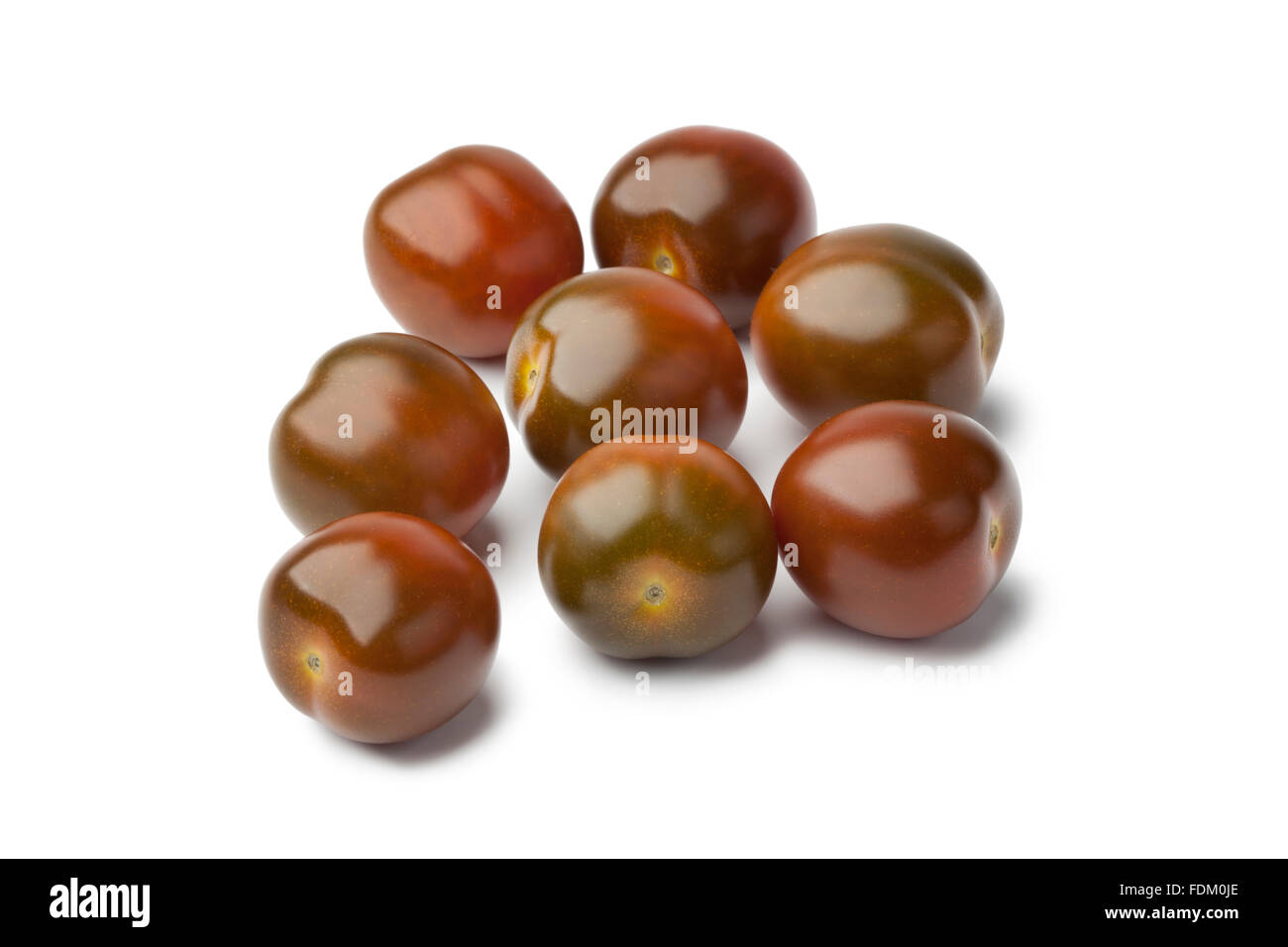 Heap of brown tomatoes on white background Stock Photo - Alamy