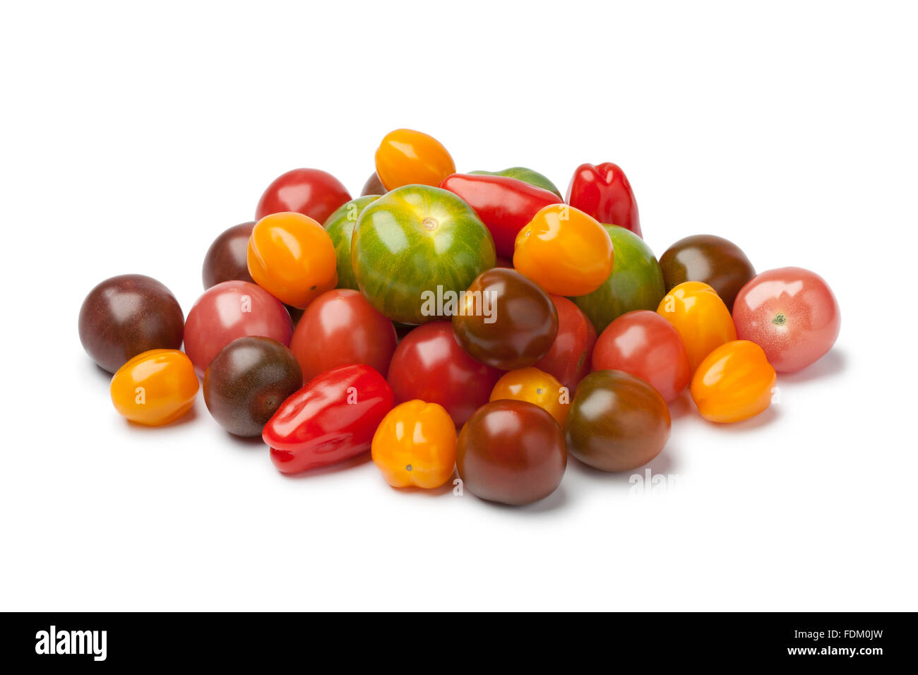 Heap of different type tomatoes on white background Stock Photo - Alamy