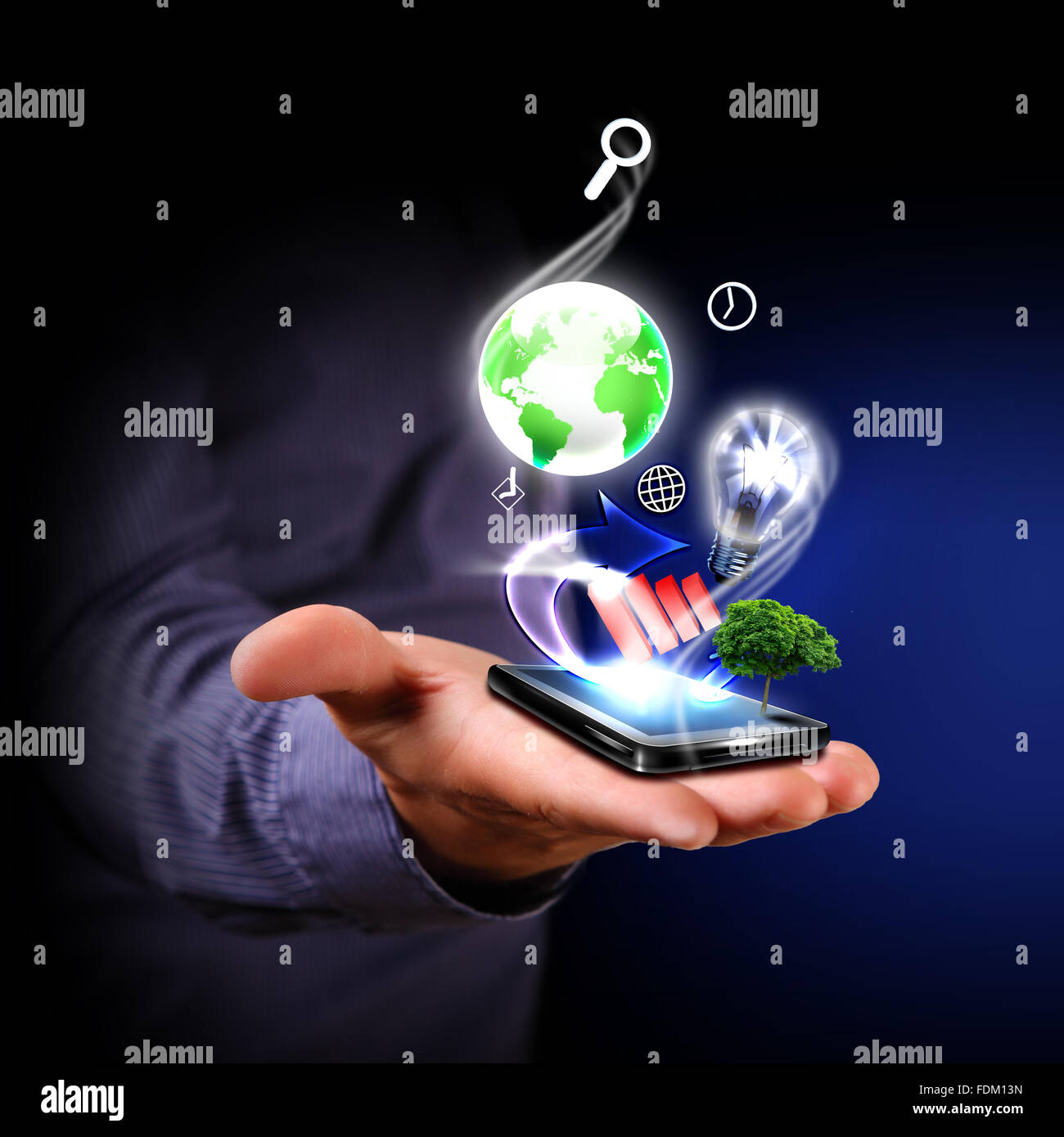 Hand of a businessman holding financial symbols Stock Photo - Alamy