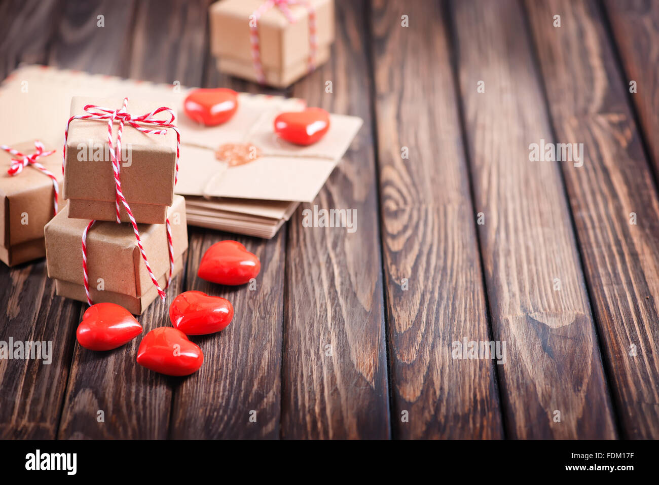box for present and hearts on the wooden table Stock Photo - Alamy