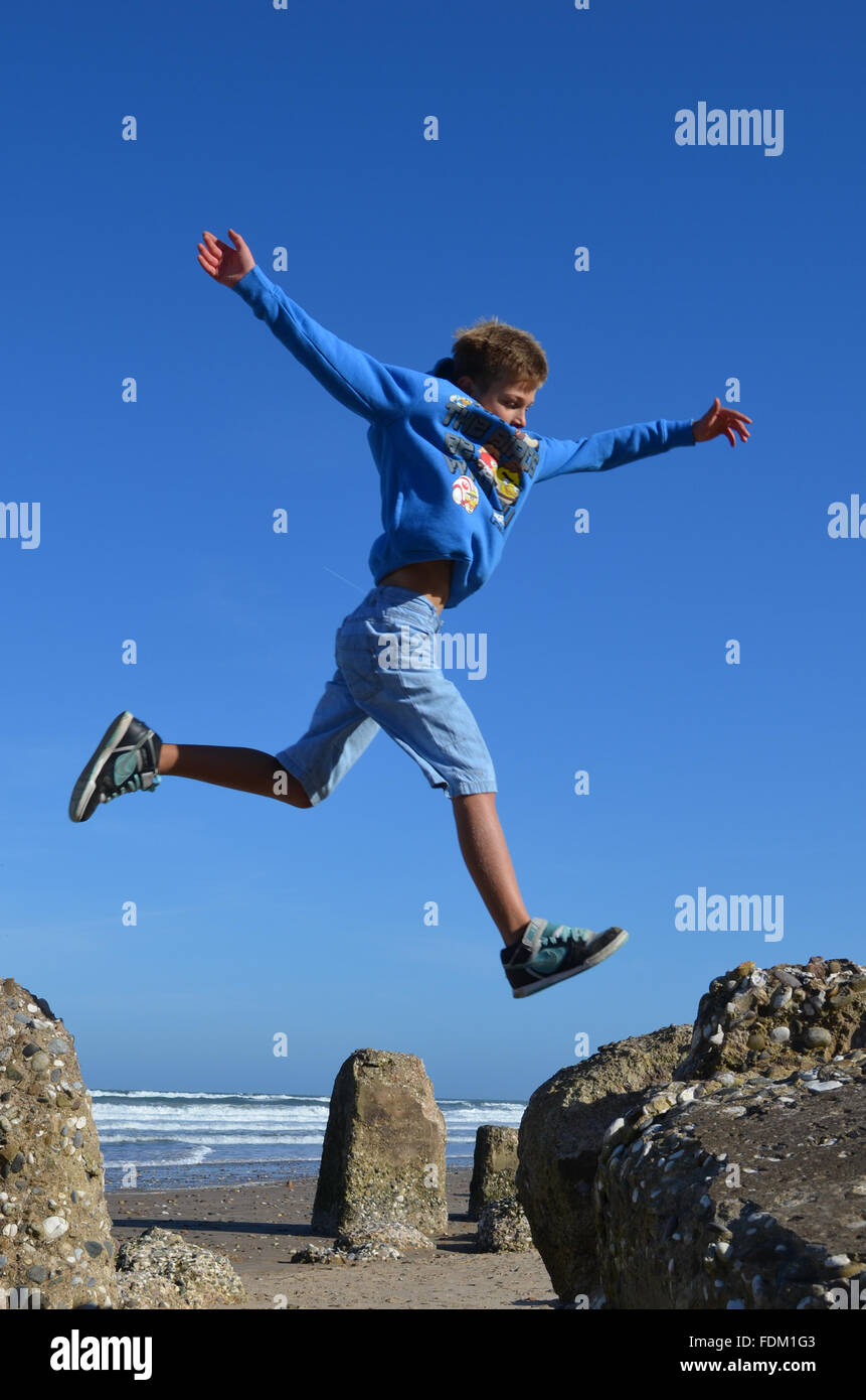 Boy jumping into the sea hi-res stock photography and images - Alamy