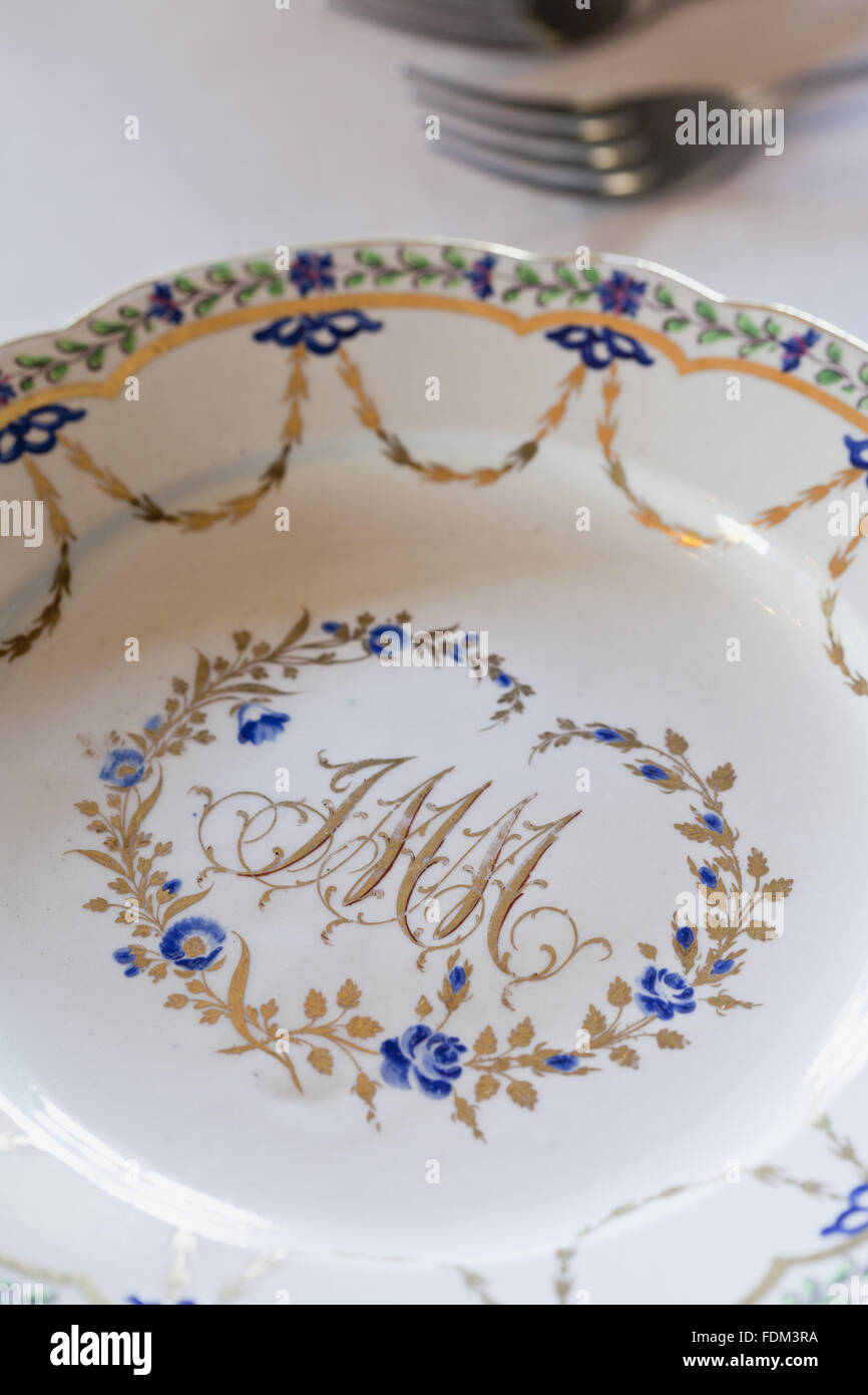 Detail of a ceramic dinner plate with the family initials JMM at ...