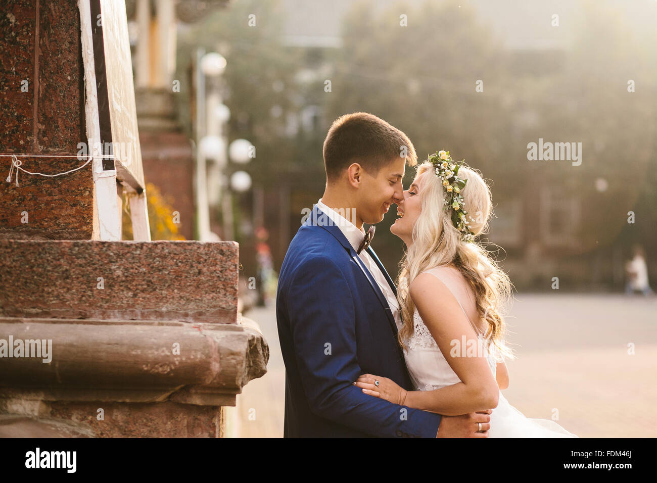 Groom holds bride in arms hi-res stock photography and images - Alamy