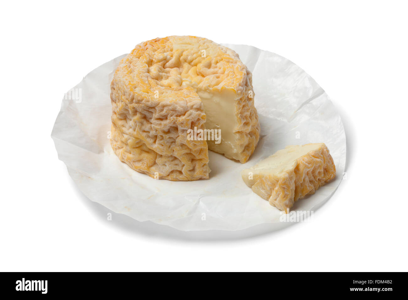 Langres cheese wrapped in paper on white background Stock Photo - Alamy