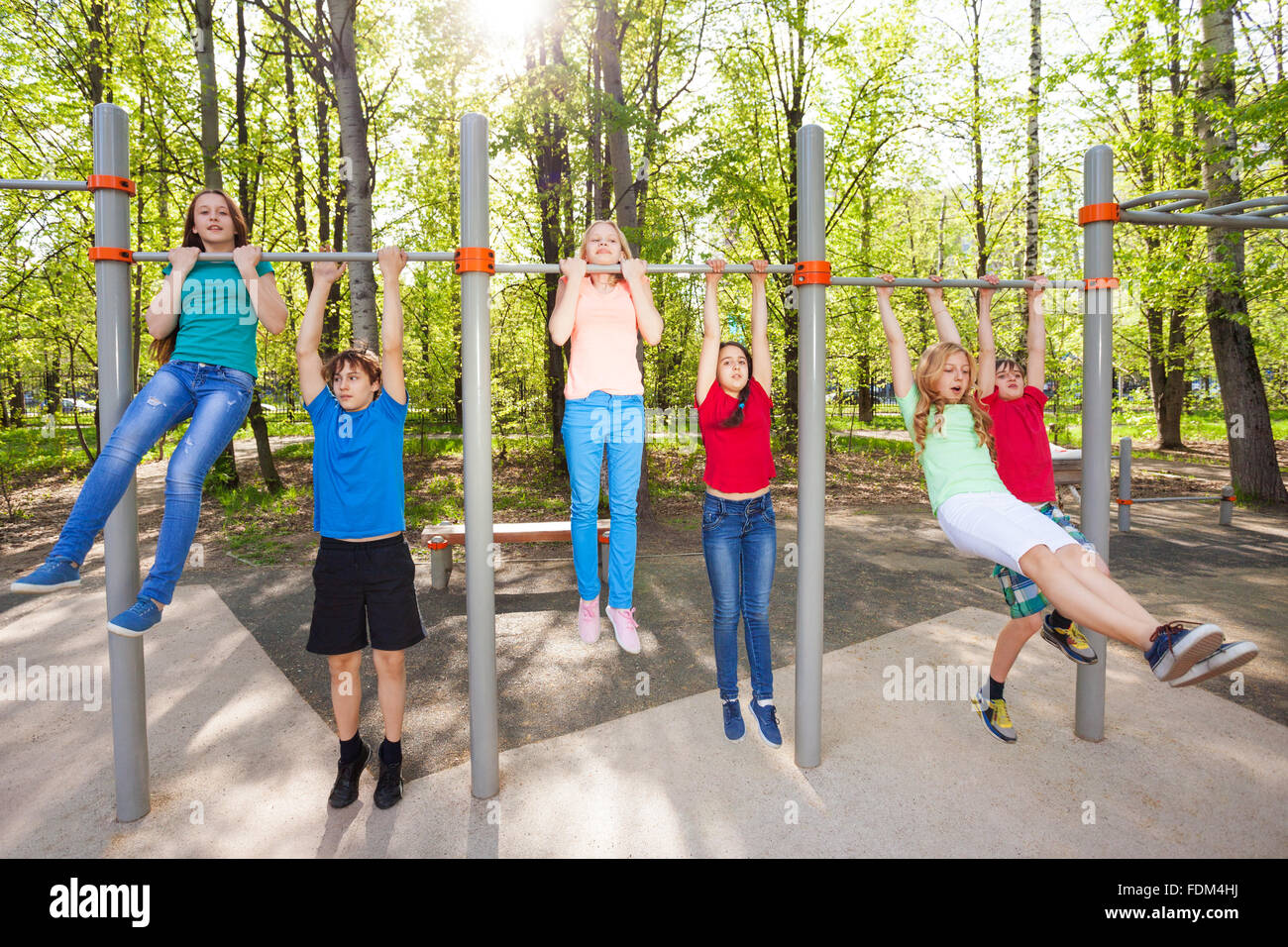 Friends chin up on the playground together Stock Photo - Alamy