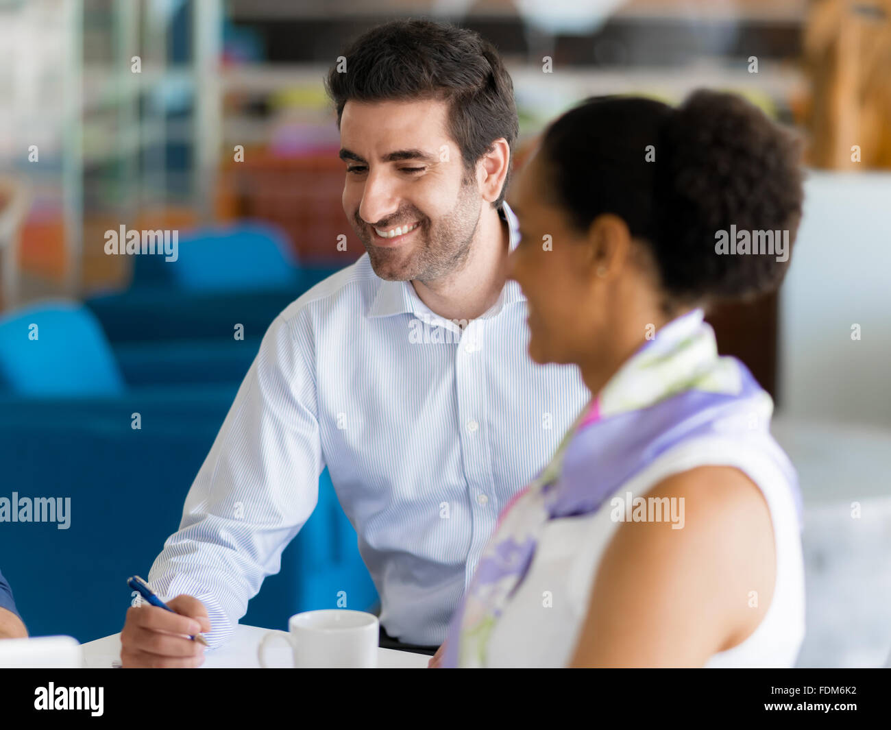 Collegues working together in an office Stock Photo - Alamy