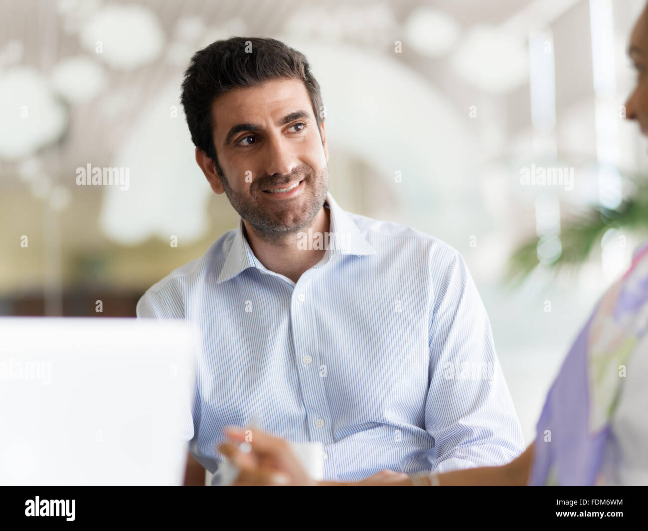 Young happy professional in office Stock Photo - Alamy