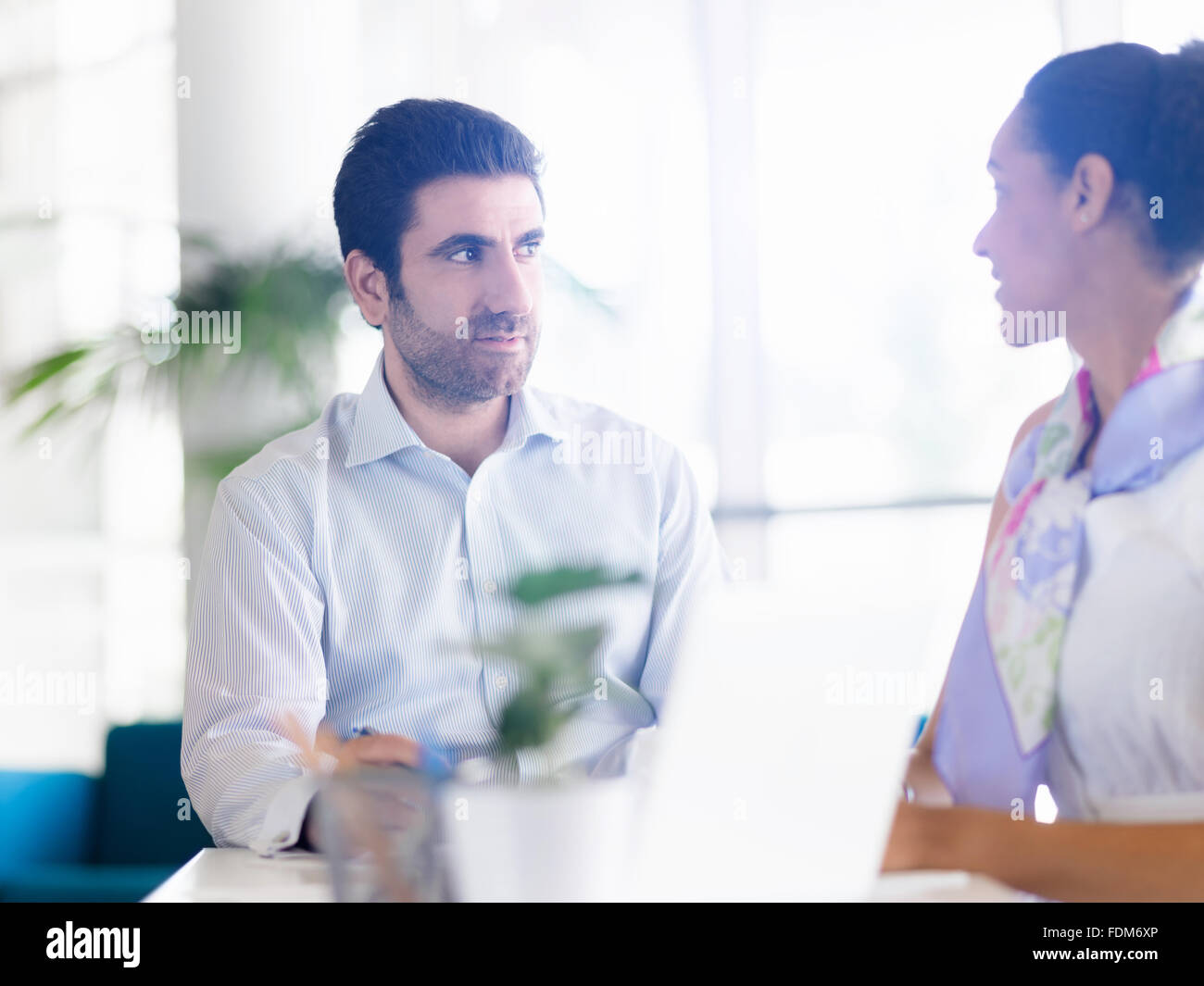 Collegues working together in an office Stock Photo - Alamy