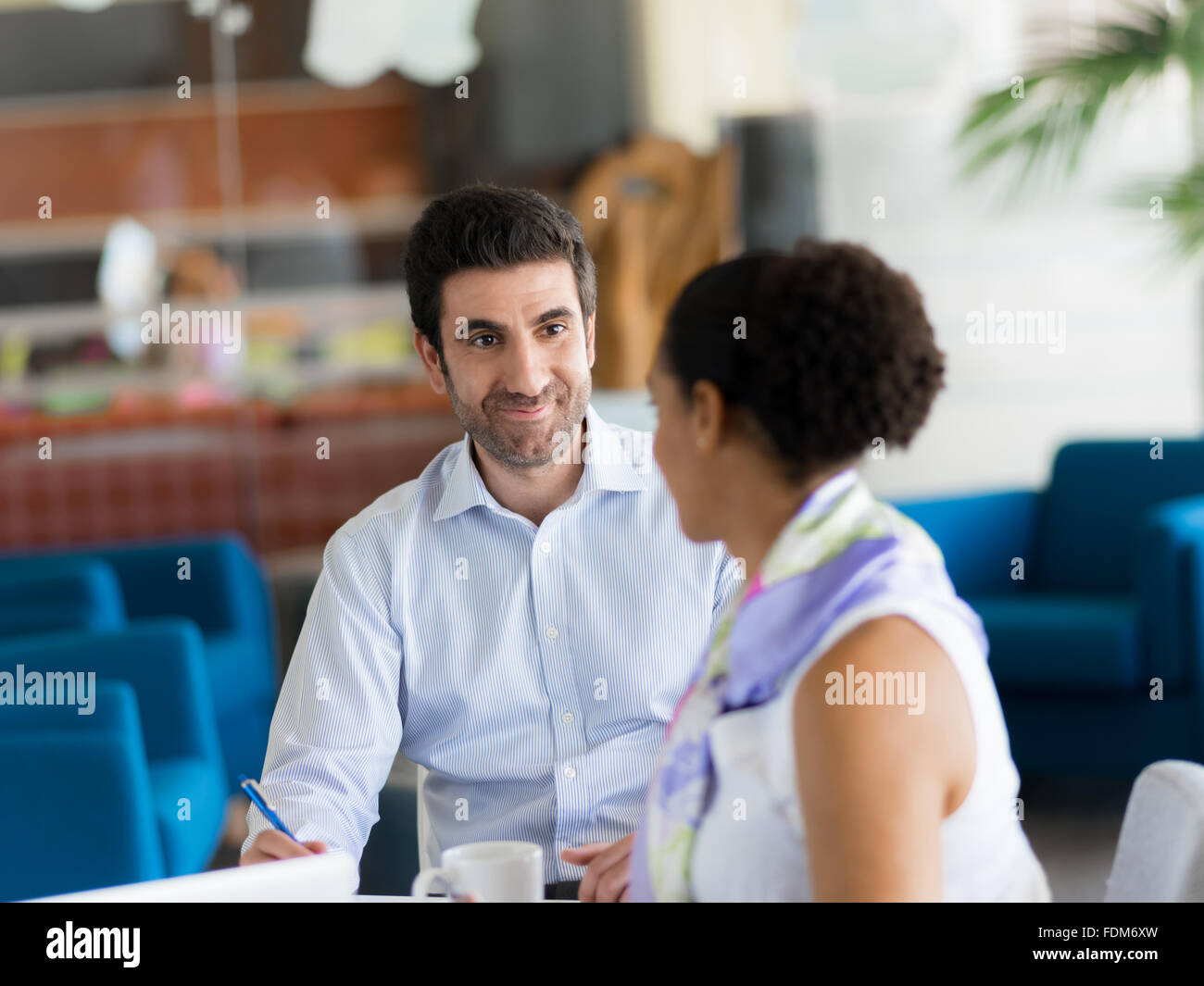 Collegues working together in an office Stock Photo - Alamy