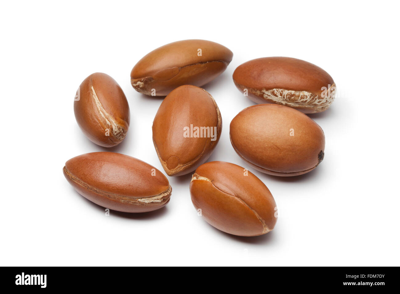 Whole Moroccan Argan nuts on white background Stock Photo - Alamy