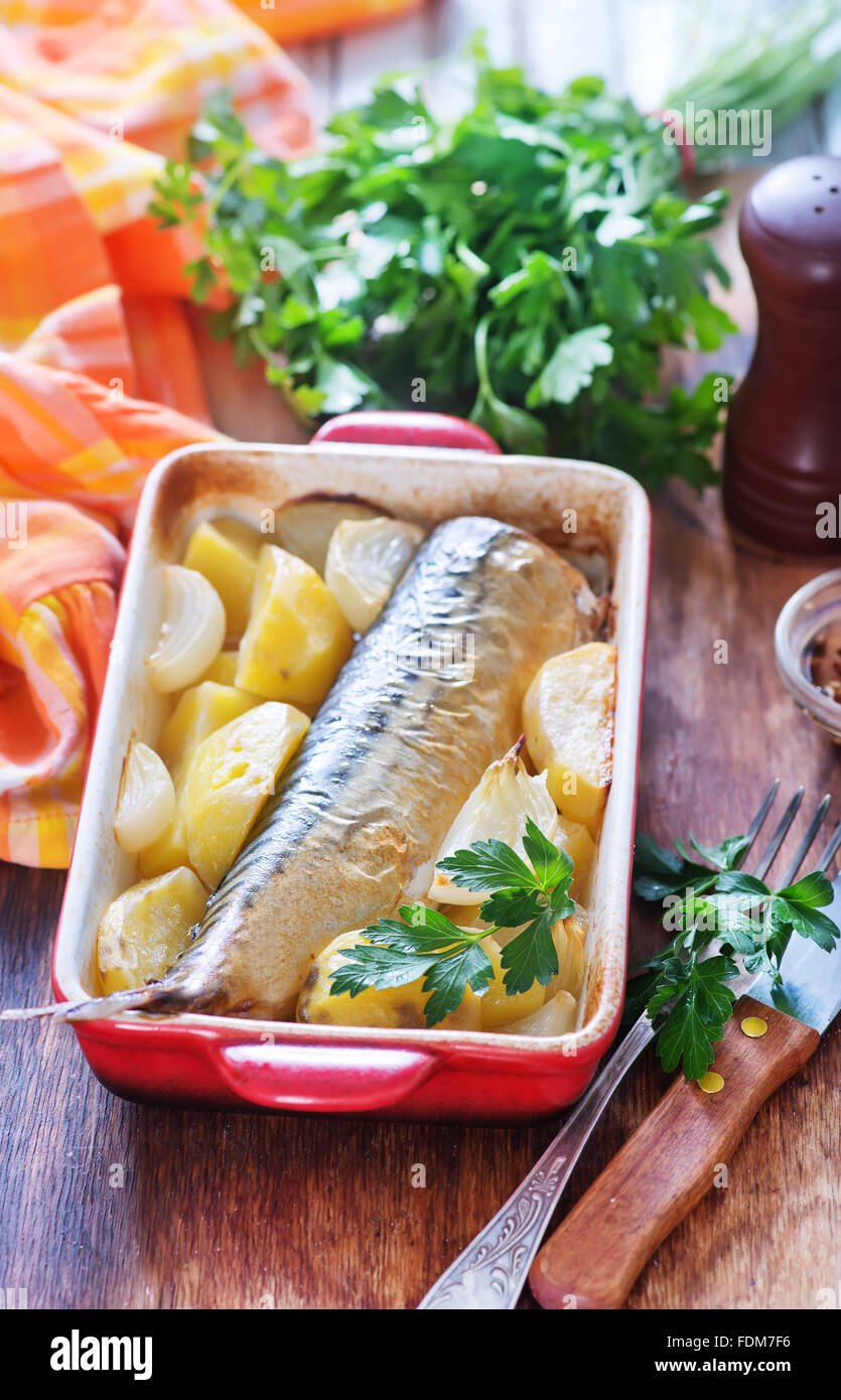 baked potato with baked fish for dinner Stock Photo - Alamy