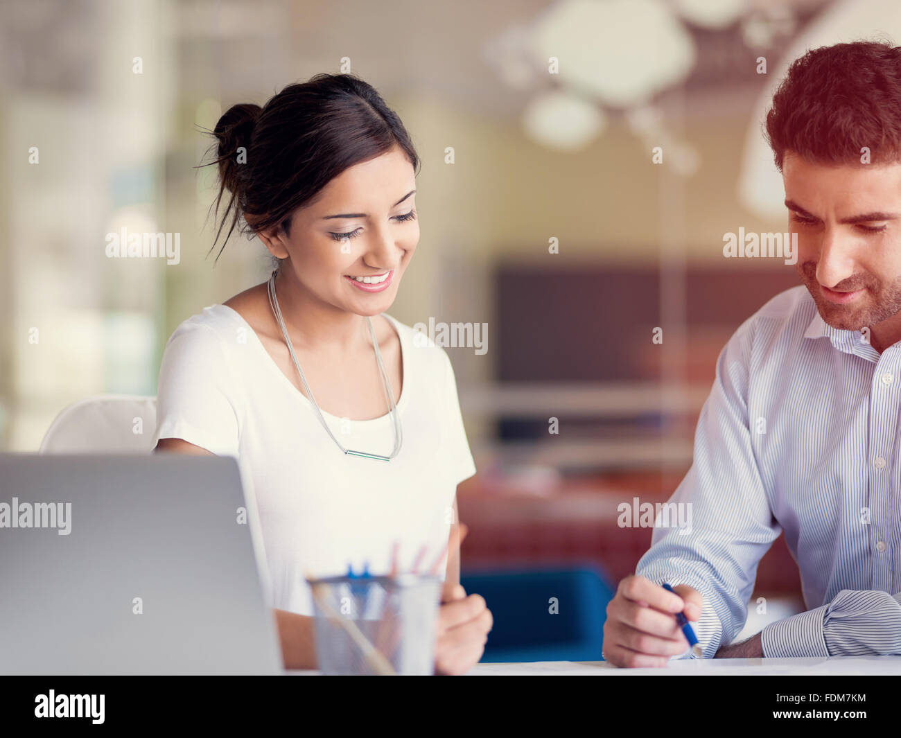 Two collegues working together in an office Stock Photo - Alamy