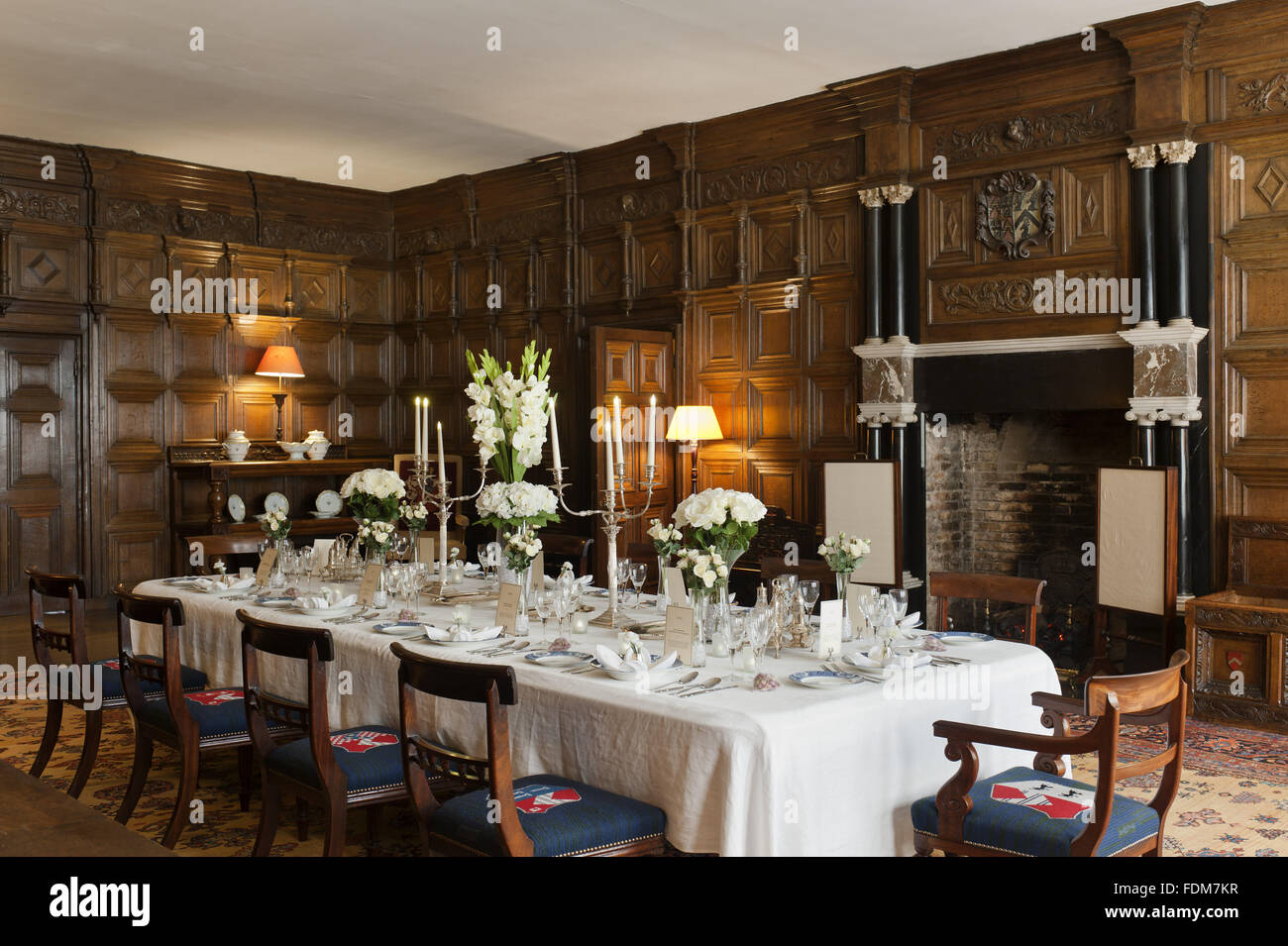 The Dining Room with the table laid with place settings, candles and ...