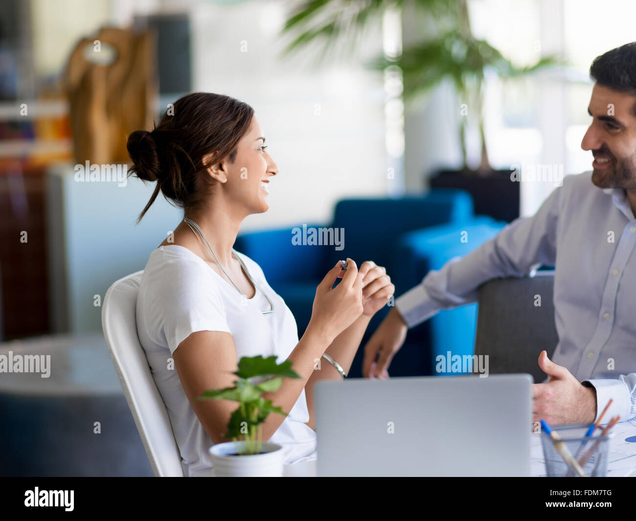 Two collegues working together in an office Stock Photo - Alamy