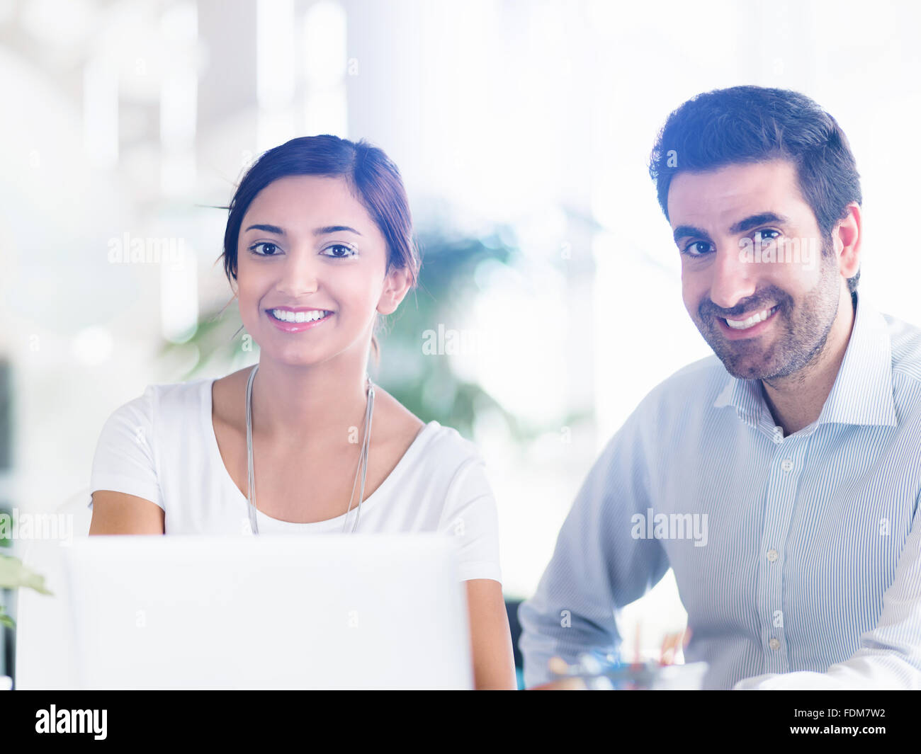 Two collegues working together in an office Stock Photo - Alamy