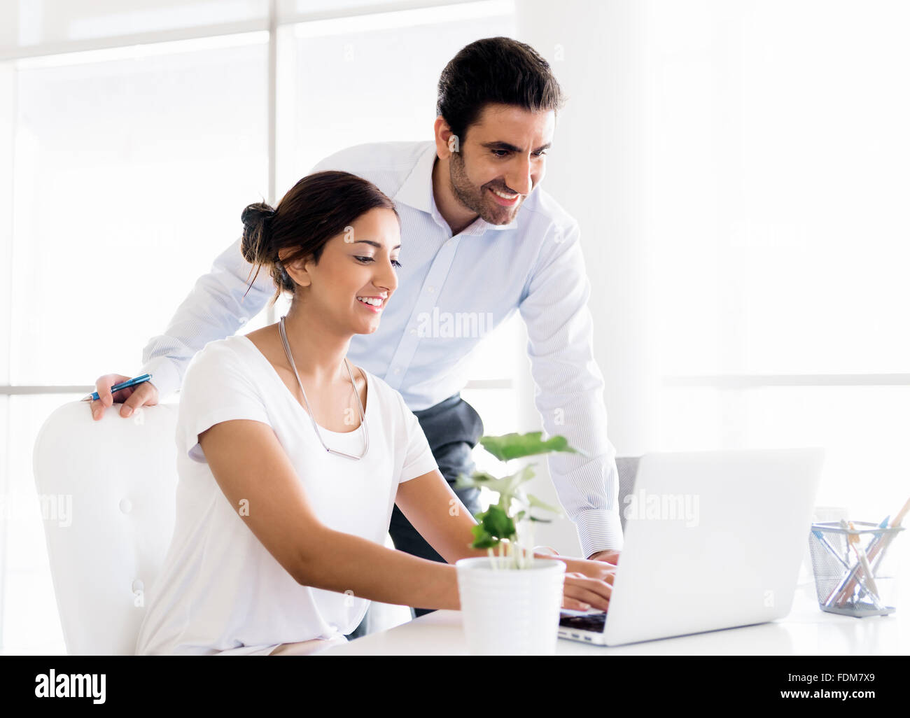 Two collegues working together in an office Stock Photo - Alamy
