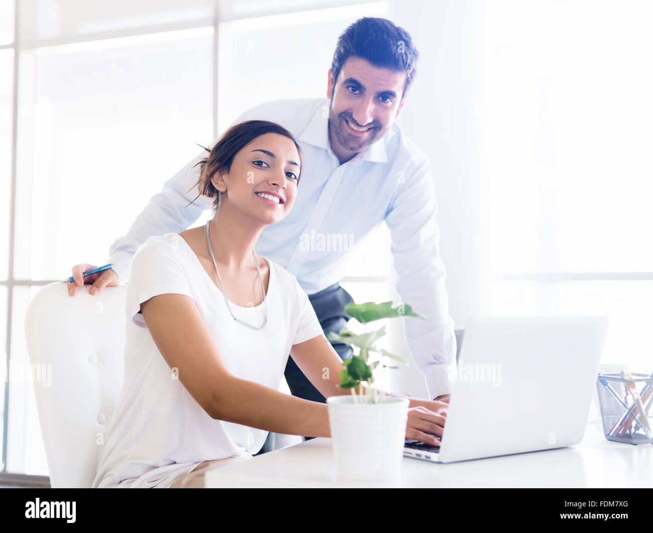 Two collegues working together in an office Stock Photo - Alamy