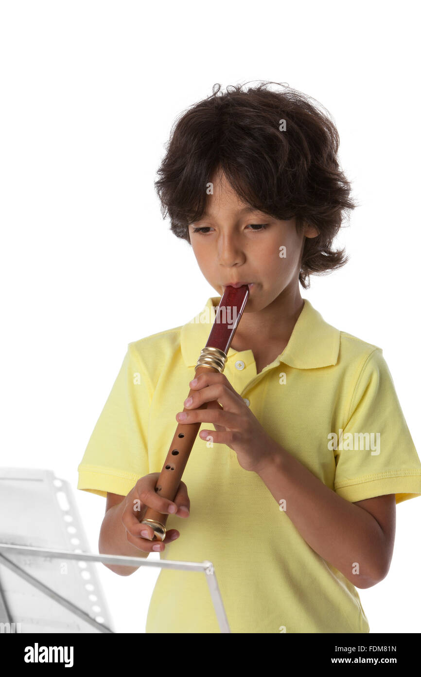 Little boy is playing the recorder on white background Stock Photo - Alamy