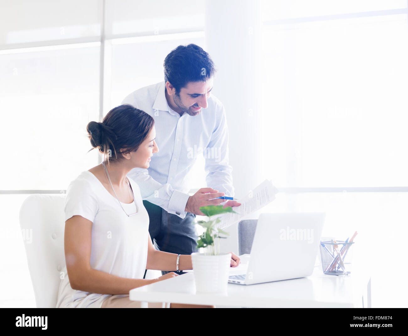 Two collegues working together in an office Stock Photo - Alamy
