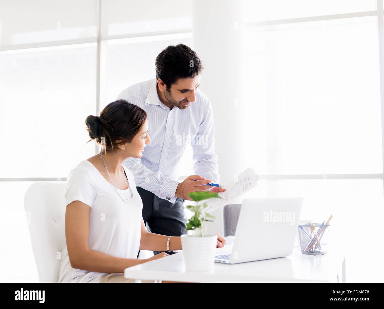 Two collegues working together in an office Stock Photo - Alamy