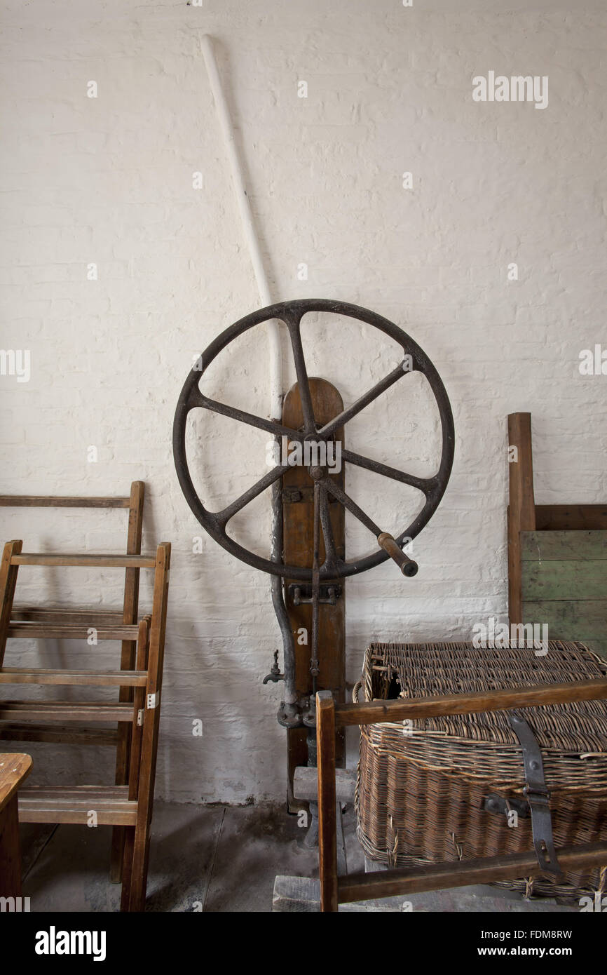 Pulley wheel in the Mangle Room at Dunham Massey, Cheshire Stock Photo ...