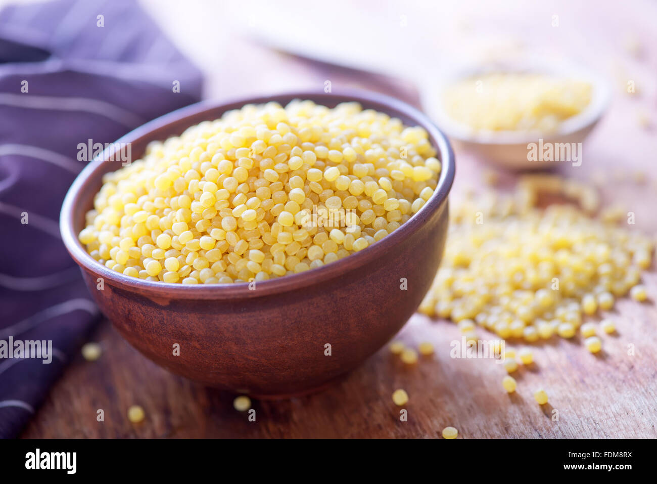 raw ptitim in bowl and on a table Stock Photo - Alamy
