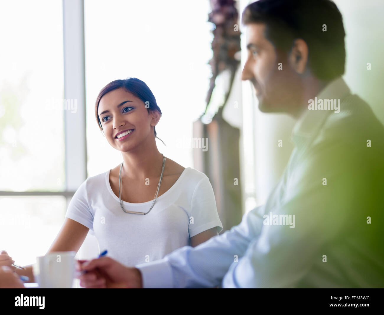 Team having a discussion in office Stock Photo - Alamy