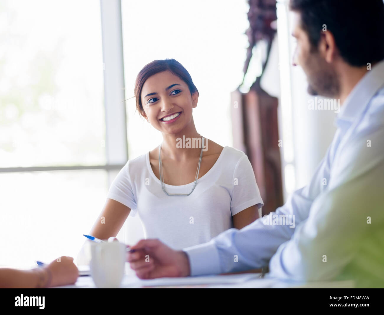 Team having a discussion in office Stock Photo - Alamy