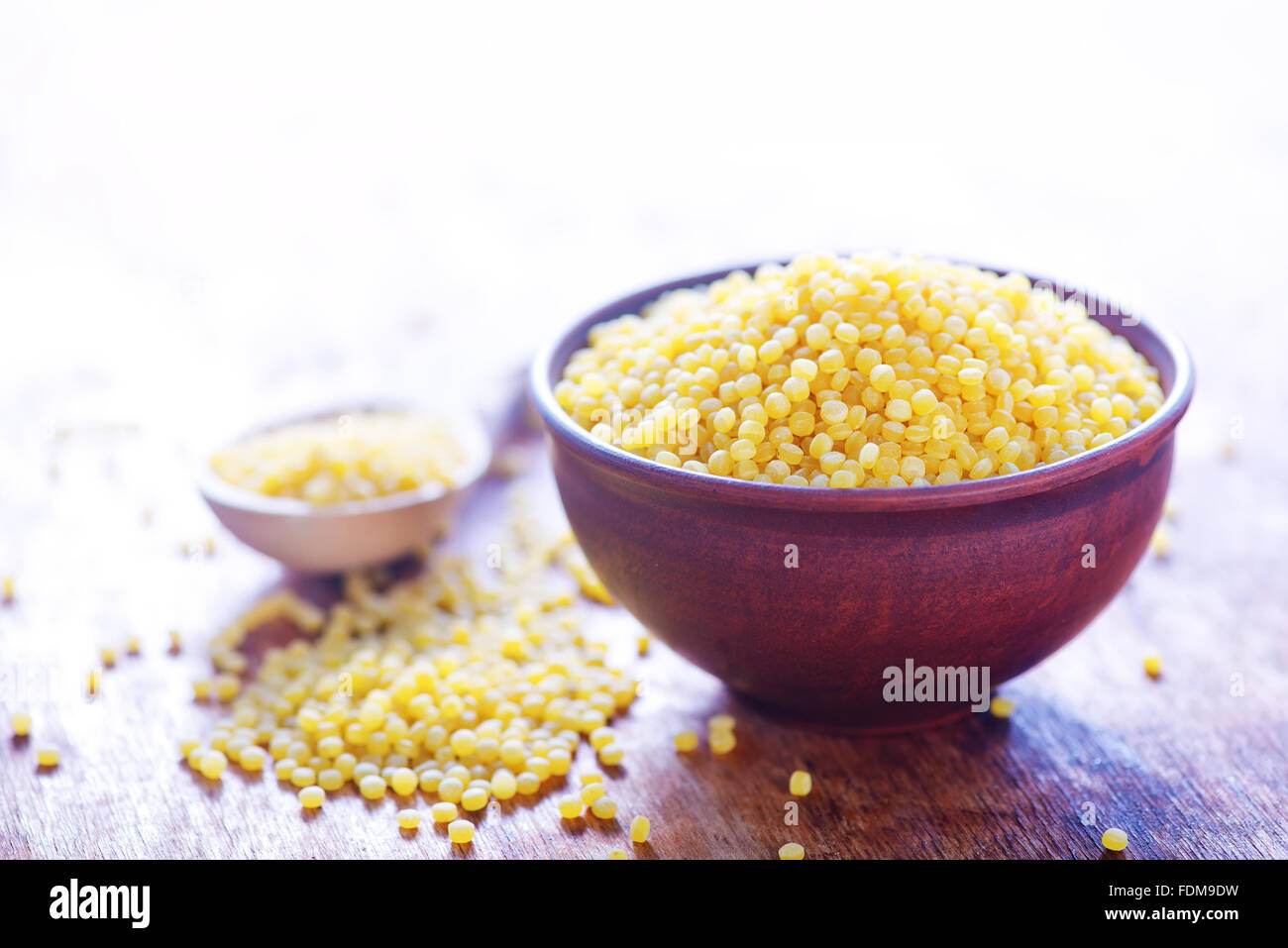 raw ptitim in bowl and on a table Stock Photo - Alamy