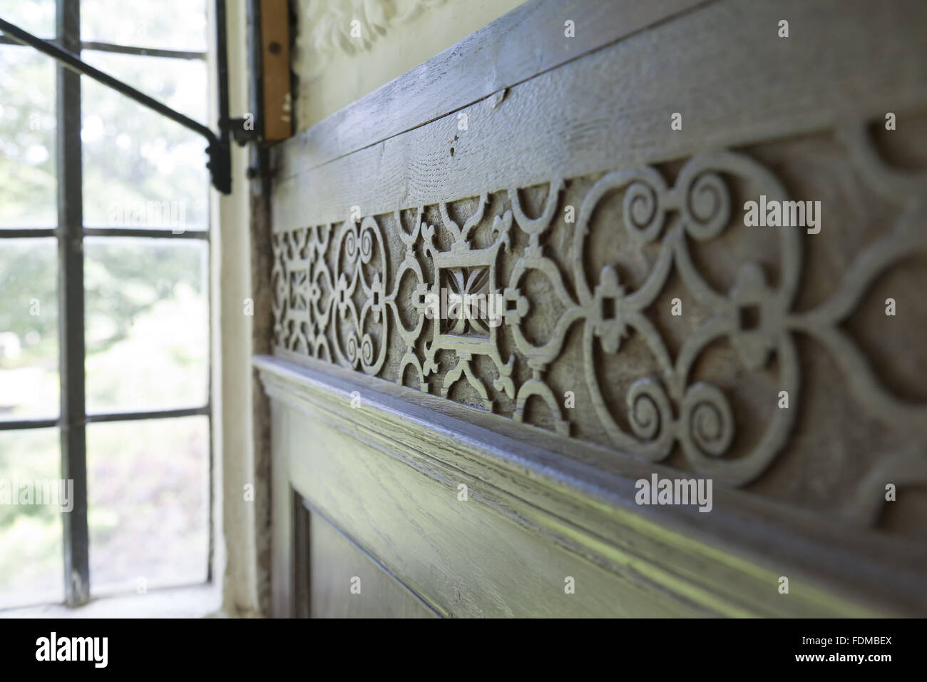 The carved border at the top of the oak panelling in the Tudor Bedroom ...