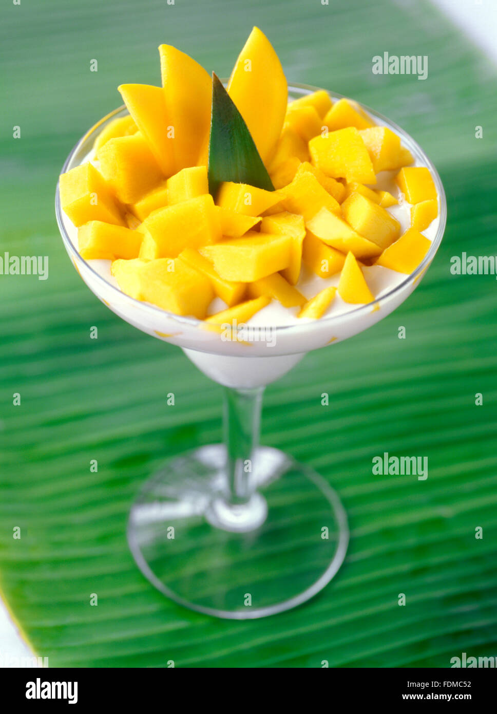 A coconut Pannacotta desert with fresh mango slices at Mandala Spa ...