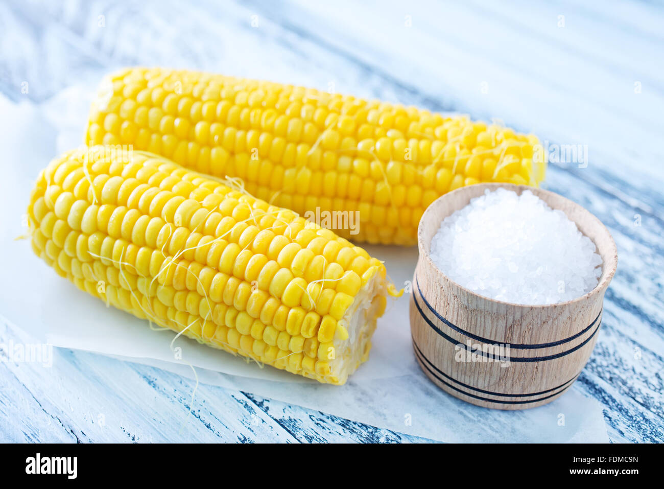 boiled corn with salt on a table Stock Photo - Alamy