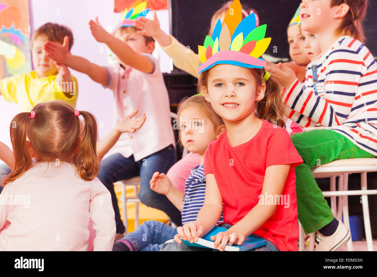Girl portrait among kids in kindergarten class Stock Photo - Alamy