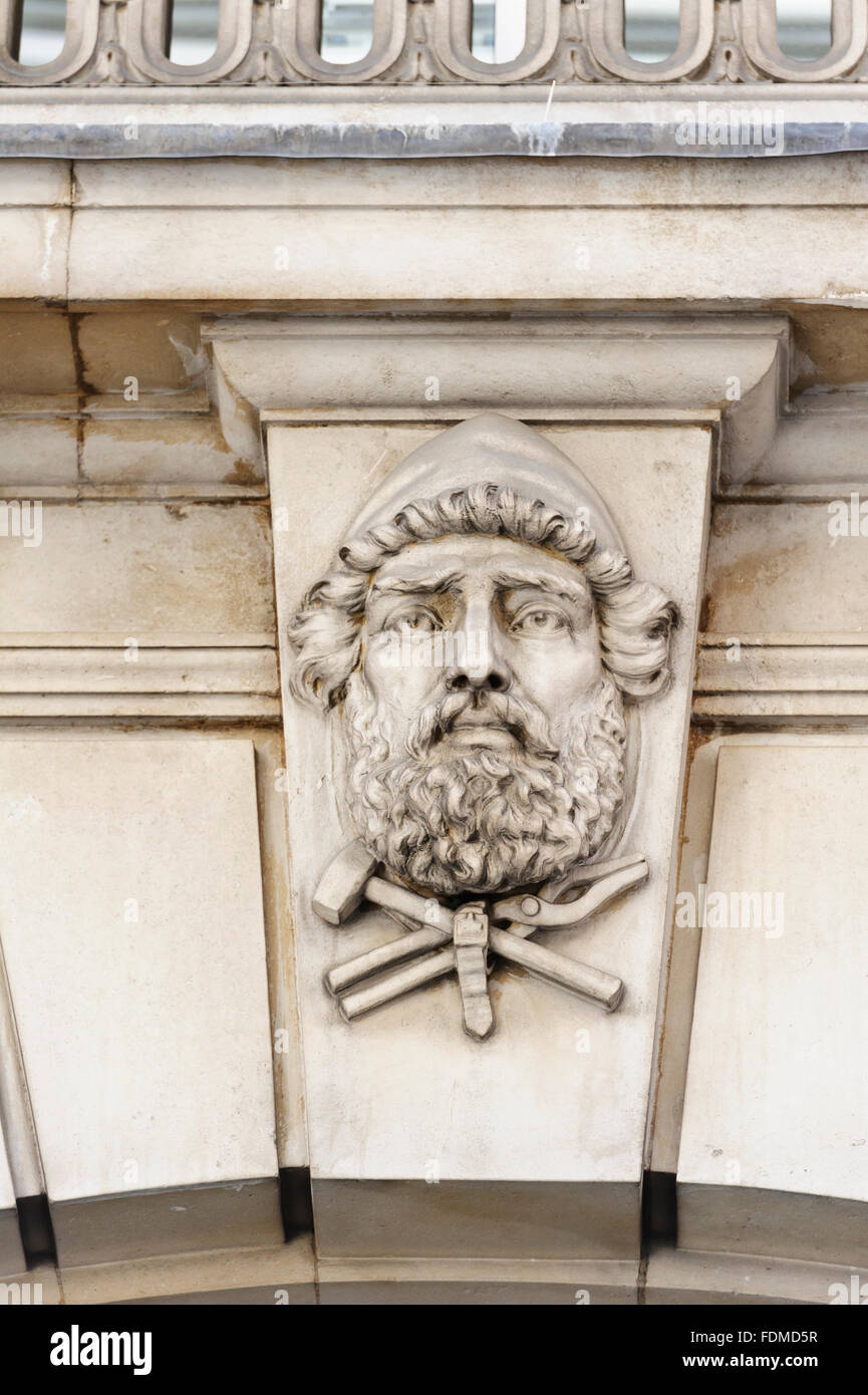 Stone carving of a face on the wall of a building in London, United ...
